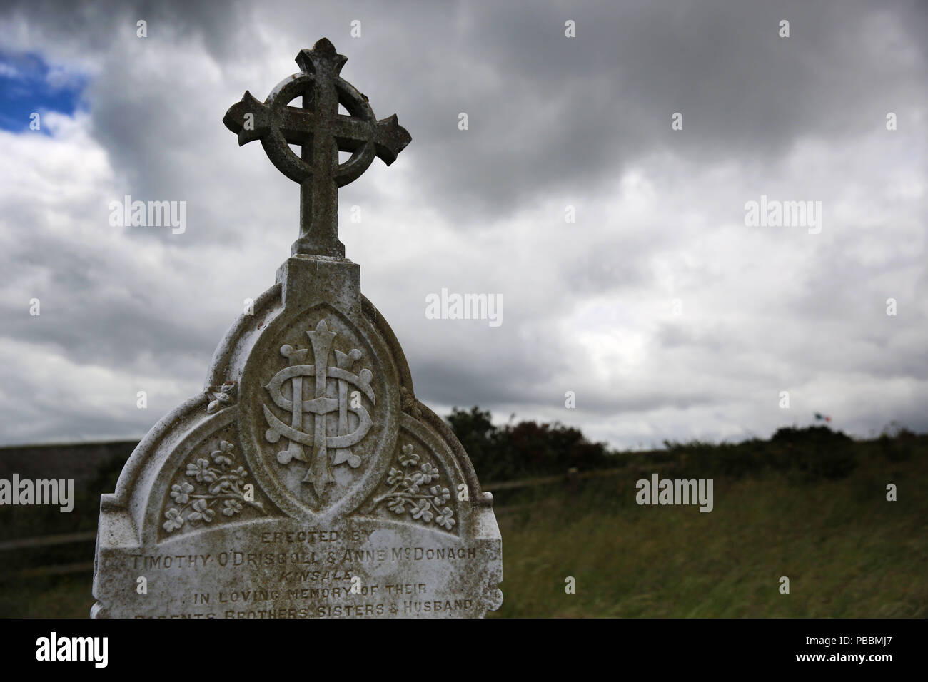 Headstones in an old overgrown cemetery near Kinsale, County Cork ...