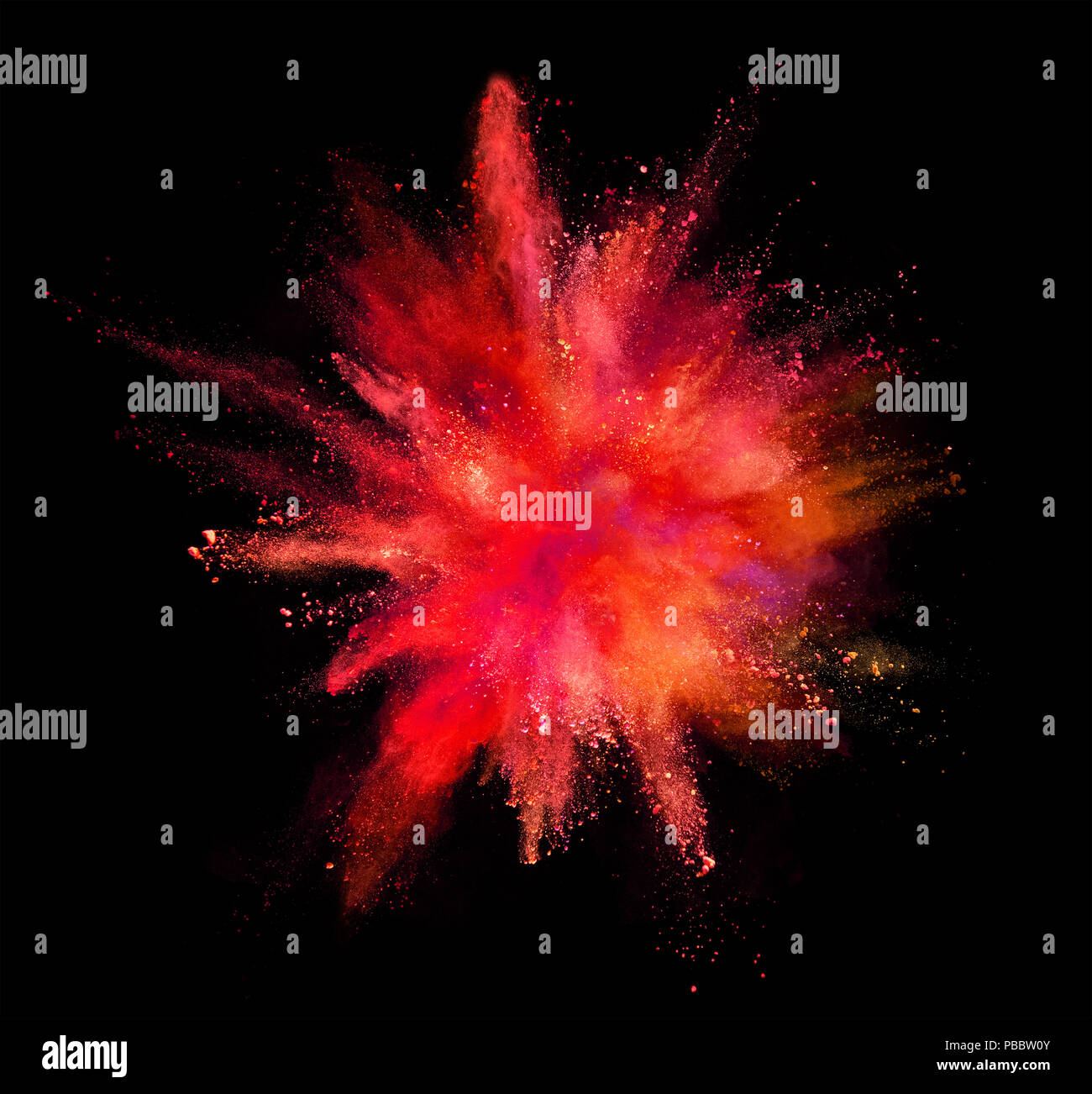 Explosion of coloured powder isolated on black background. Abstract ...