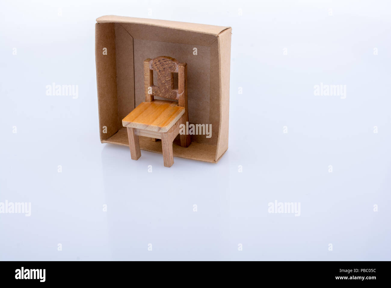 Colorful little wooden toy chair in view Stock Photo - Alamy
