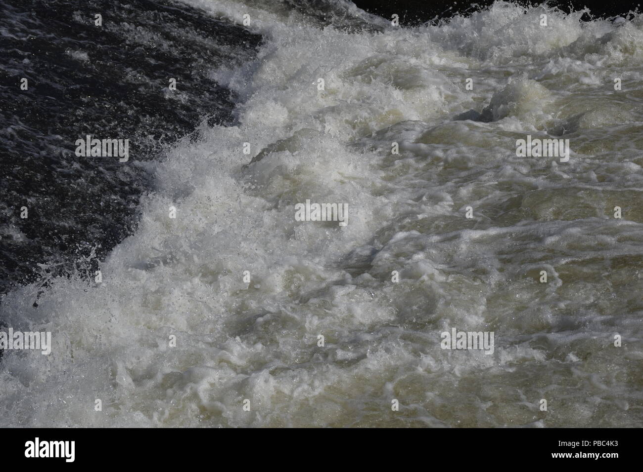 Water surface with white foam and waves pattern Stock Photo - Alamy