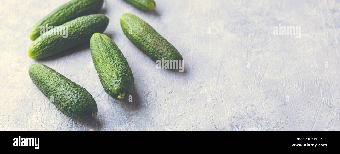 Fresh raw juicy cucumbers on a light background. Horizontal photo ...