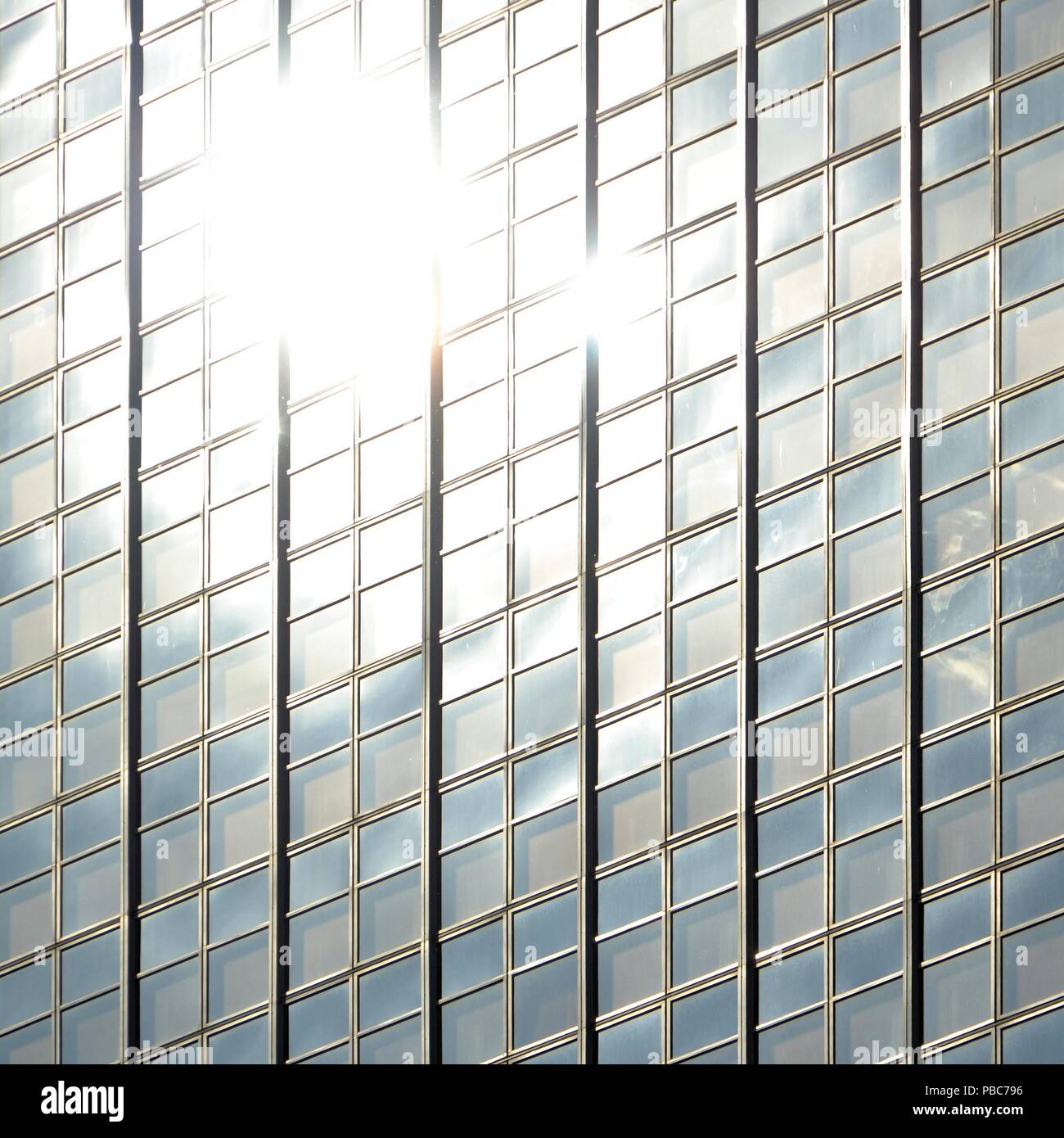Reflection of the sunlight on a glass facade Stock Photo - Alamy