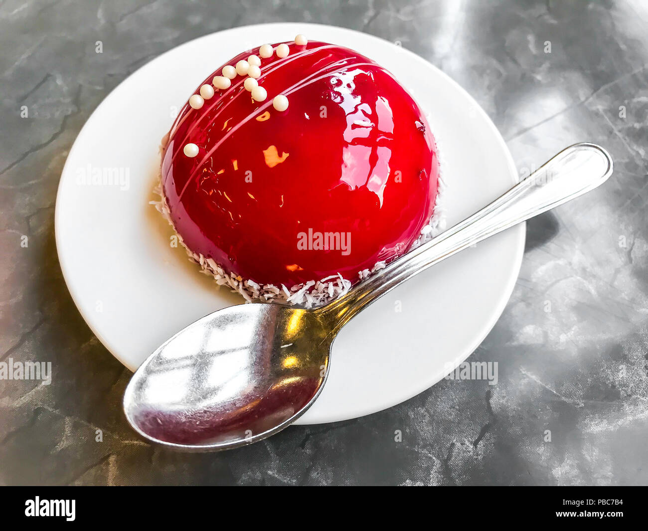 Mousse cake with red mirror glaze. Studio Photo Stock Photo - Alamy