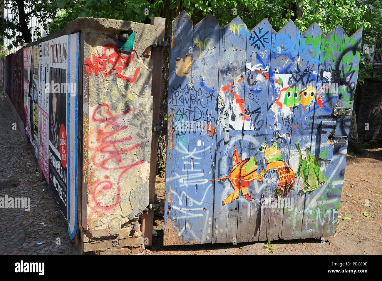 Graffiti at a gate in Berlin Stock Photo - Alamy