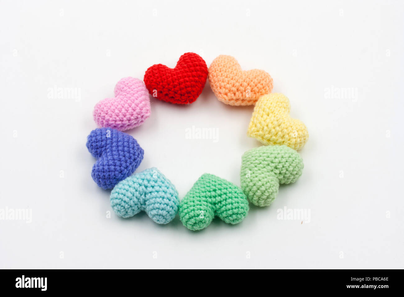 Colorful Yarn hearts on white background Stock Photo - Alamy