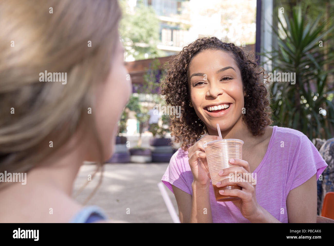 Teen girls talking outside hi-res stock photography and images - Alamy