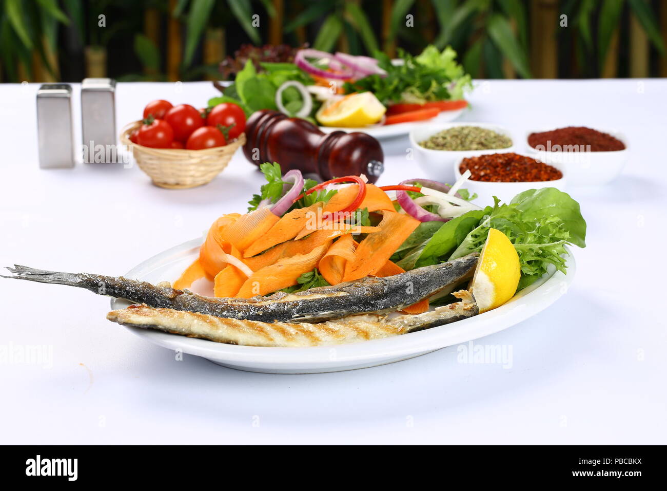 Grilled fish with vegetables Stock Photo - Alamy