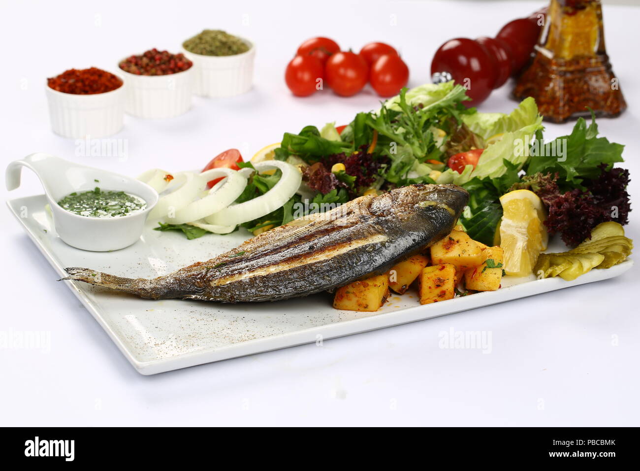 Grilled fish with vegetables Stock Photo - Alamy