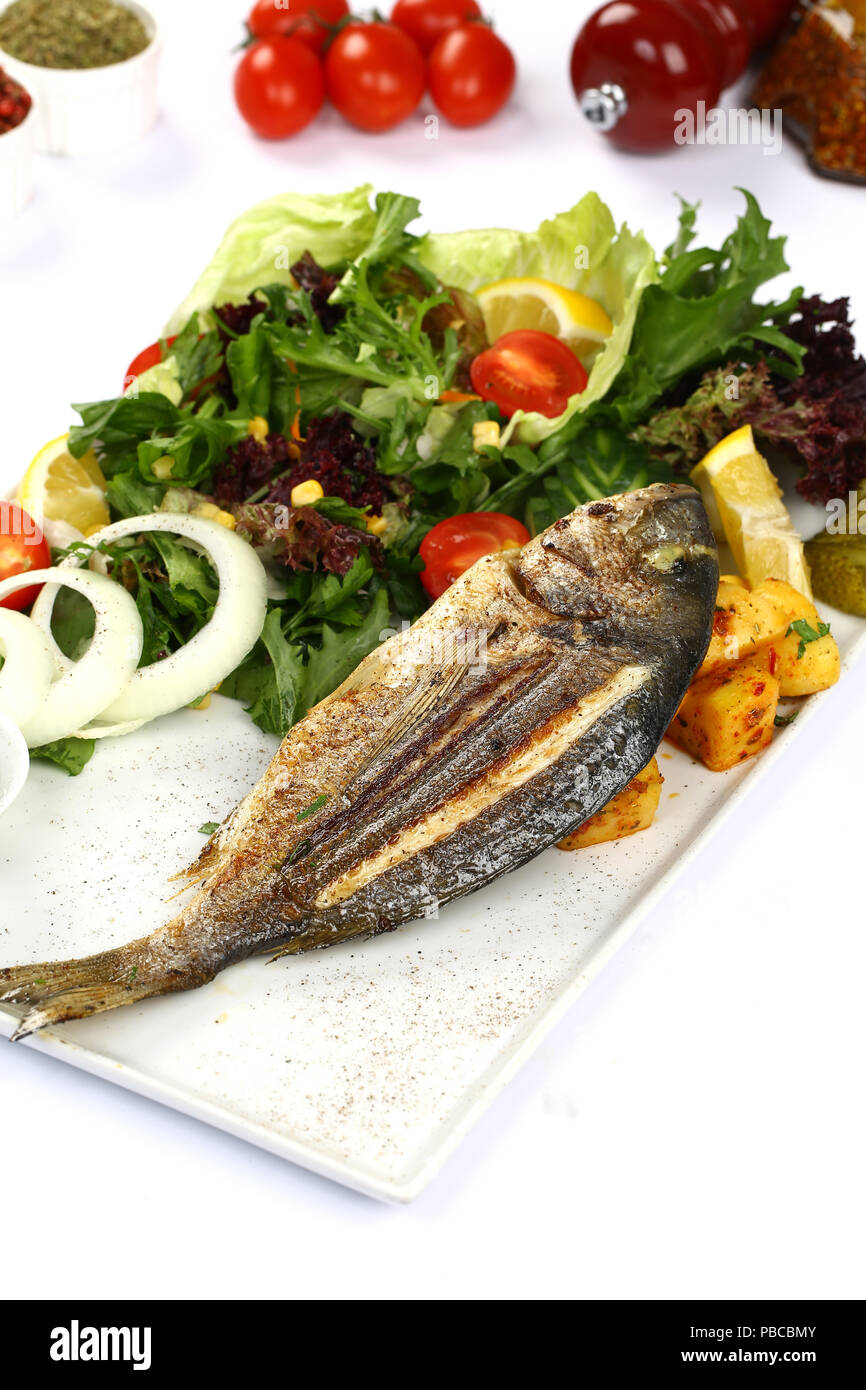 Grilled fish with vegetables Stock Photo - Alamy
