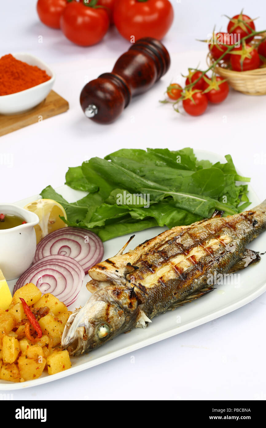 Grilled fish with vegetables Stock Photo - Alamy