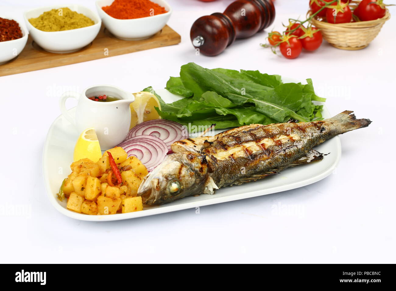 Grilled fish with vegetables Stock Photo - Alamy