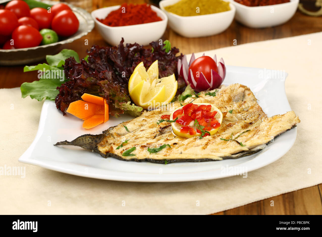 Grilled fish with vegetables Stock Photo - Alamy