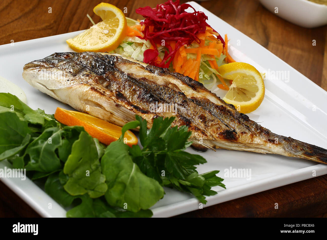 Grilled fish with vegetables Stock Photo - Alamy