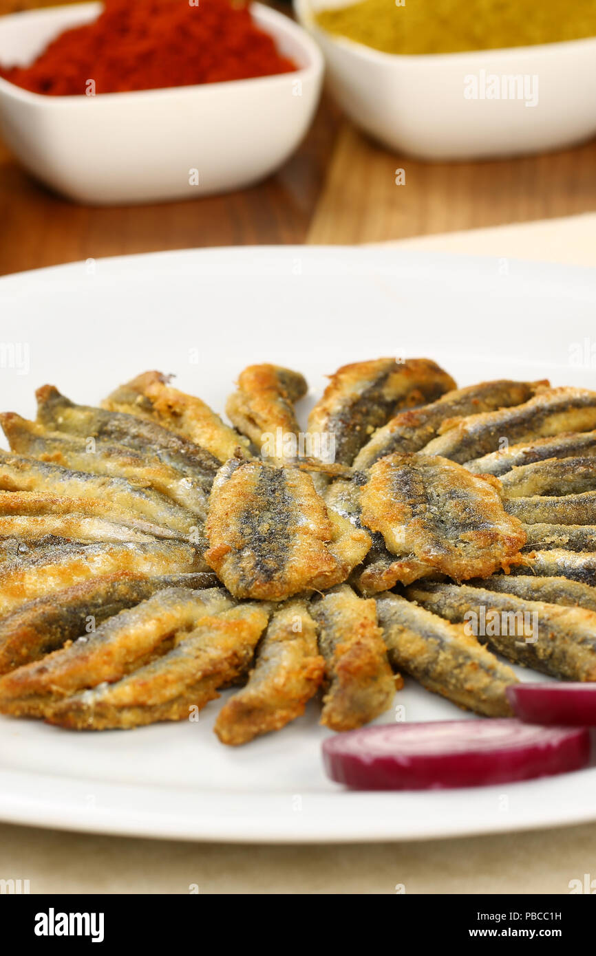 Grilled fish with vegetables - anchovy Stock Photo - Alamy
