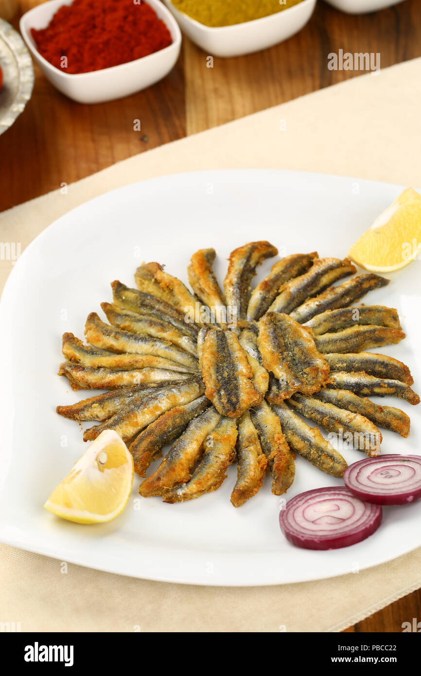 Grilled fish with vegetables - anchovy Stock Photo - Alamy