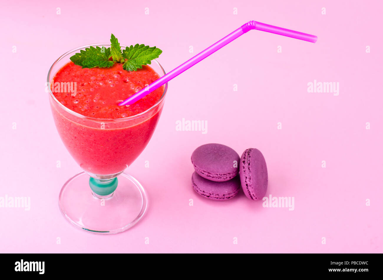 Summer concept. Fruity pink smoothies on bright colored background ...
