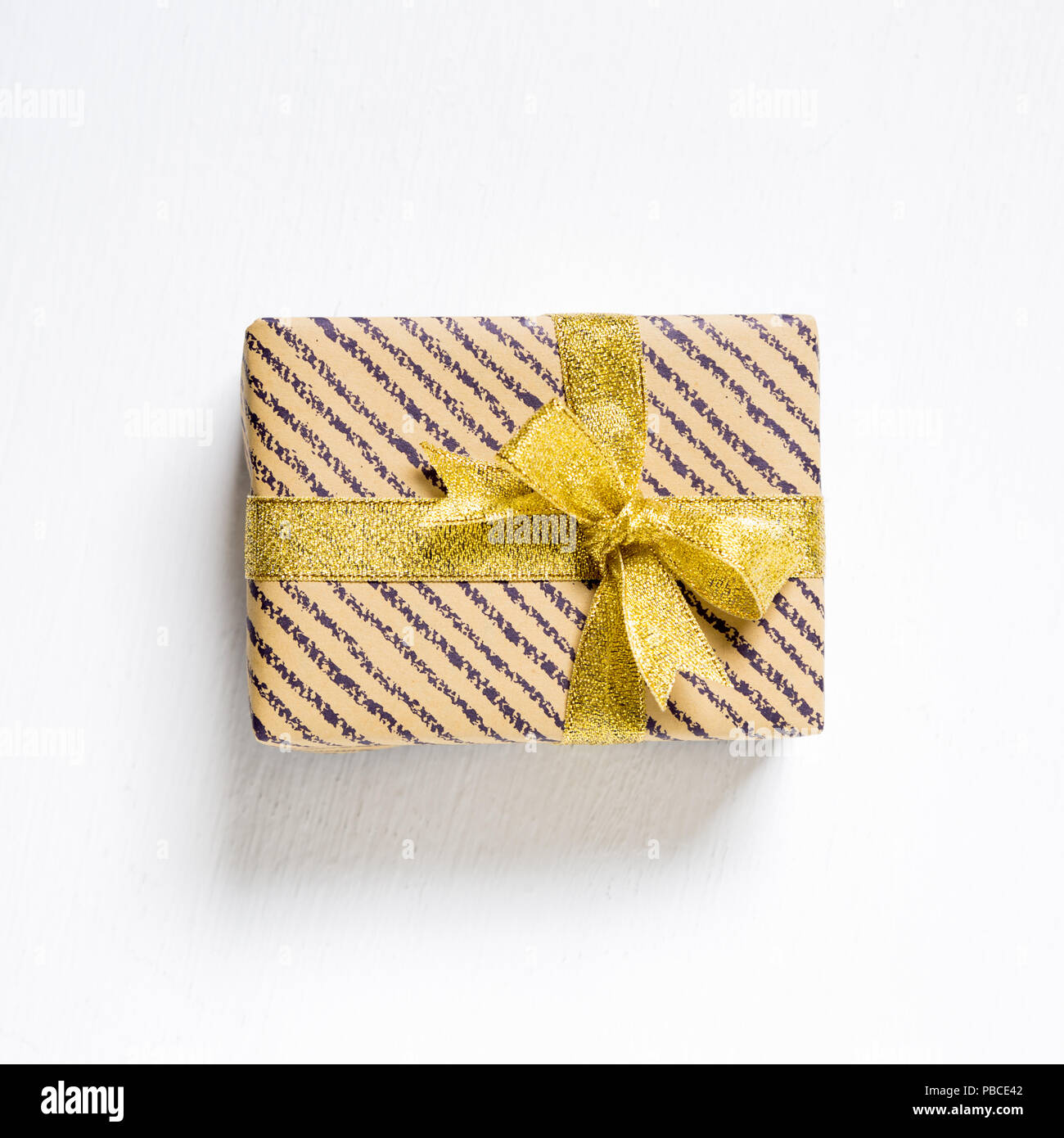 Brown color stripe pattern gift box on white background Stock Photo - Alamy