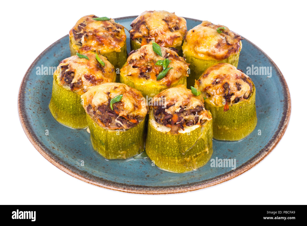 Zucchini stuffed with minced meat and vegetables. Studio Photo Stock ...