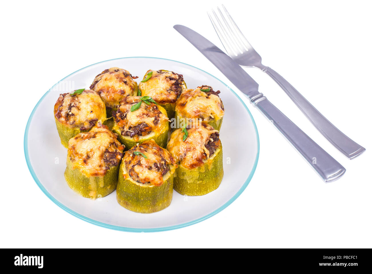 Zucchini stuffed with minced meat and vegetables. Studio Photo Stock ...