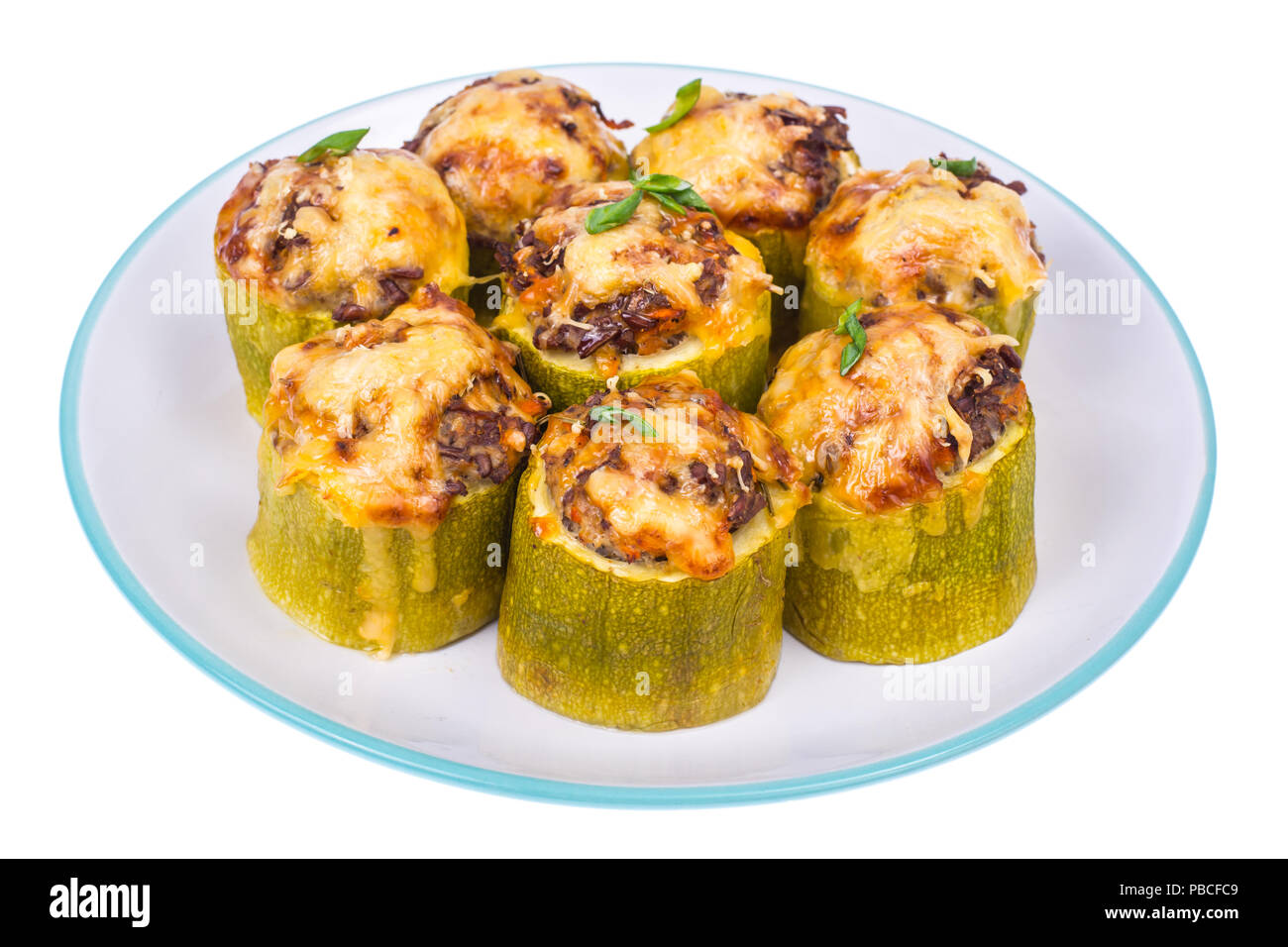 Zucchini stuffed with minced meat and vegetables. Studio Photo Stock ...