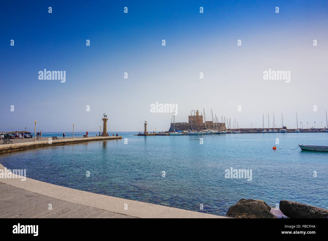 Ancient fortress and the Gate of Marina at Mandraki Harbor, Rhodes ...