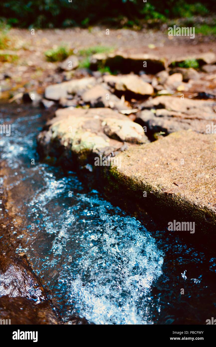 Water flowing between rocks, Nandroya Falls Circuit, Atherton ...