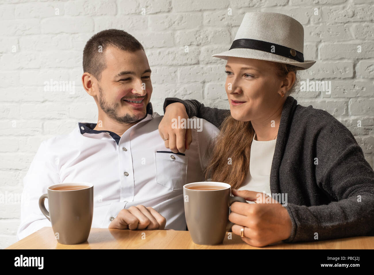 Woman talks man girl cup hi-res stock photography and images - Alamy