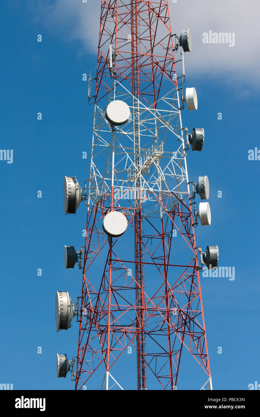 Telecommunications tower under blue sky hi-res stock photography and ...