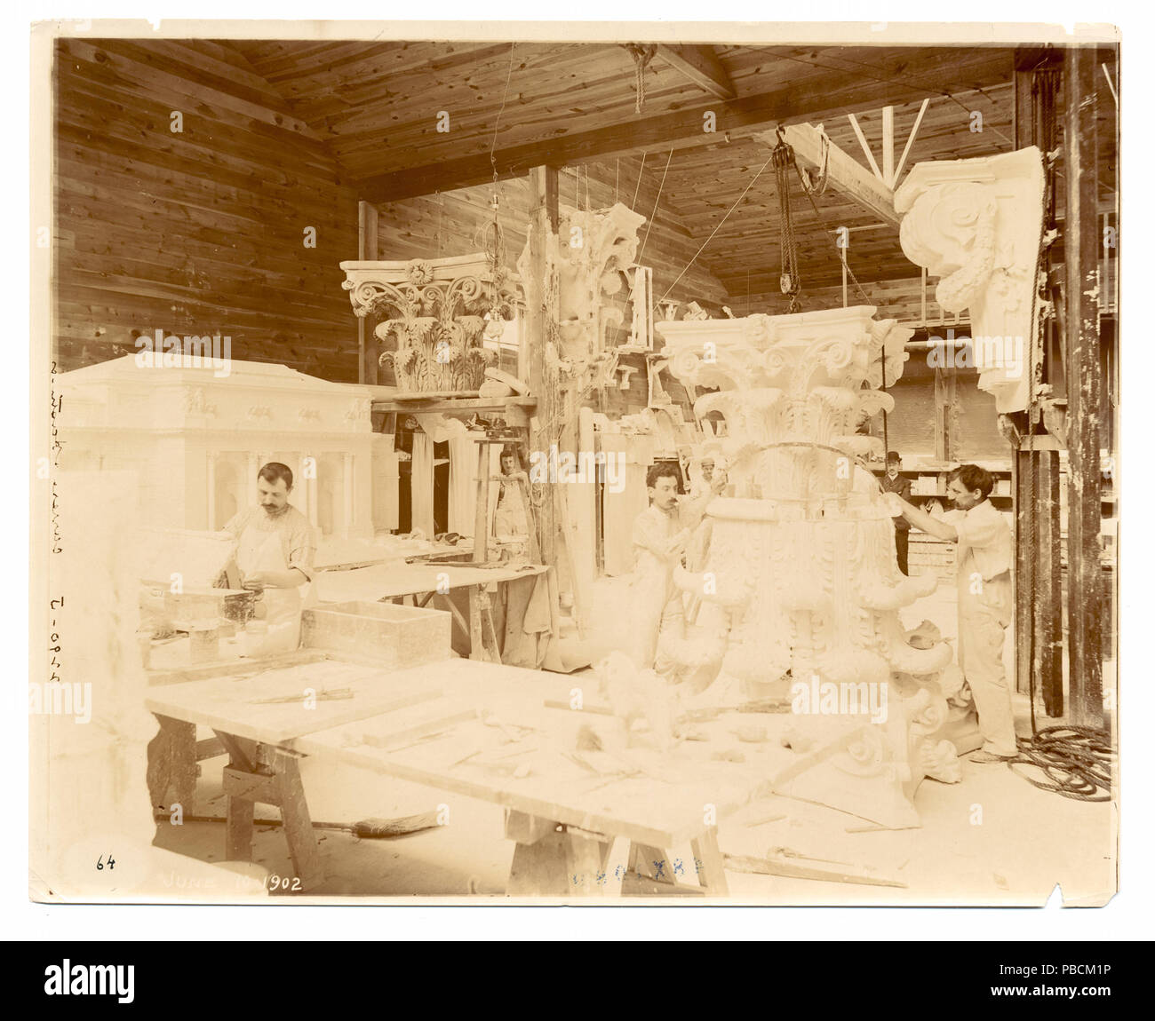 1205 Plaster workshop - men working on a model of a Corinthian capital ...