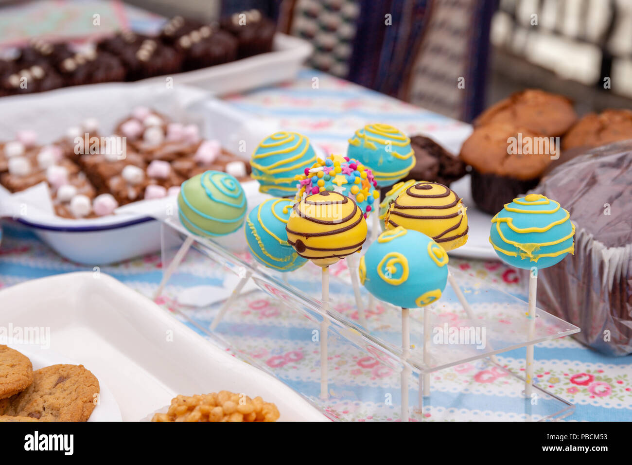 Variety of colorful hand made lollipops on a stand in a London market ...