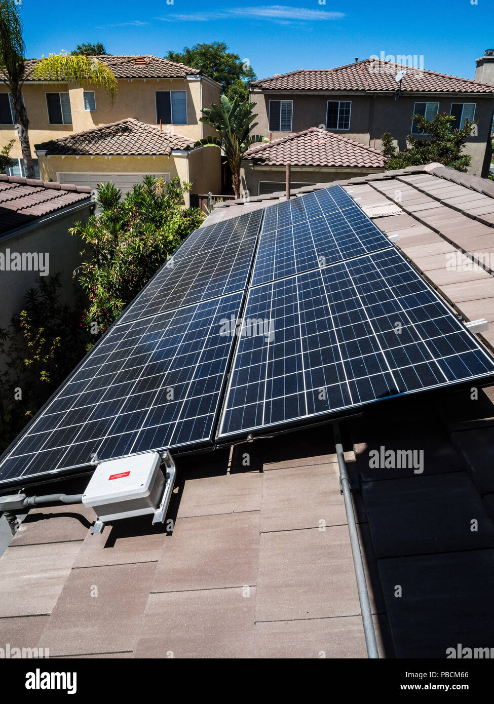 dirty solar panels on house roof in suburb Stock Photo - Alamy