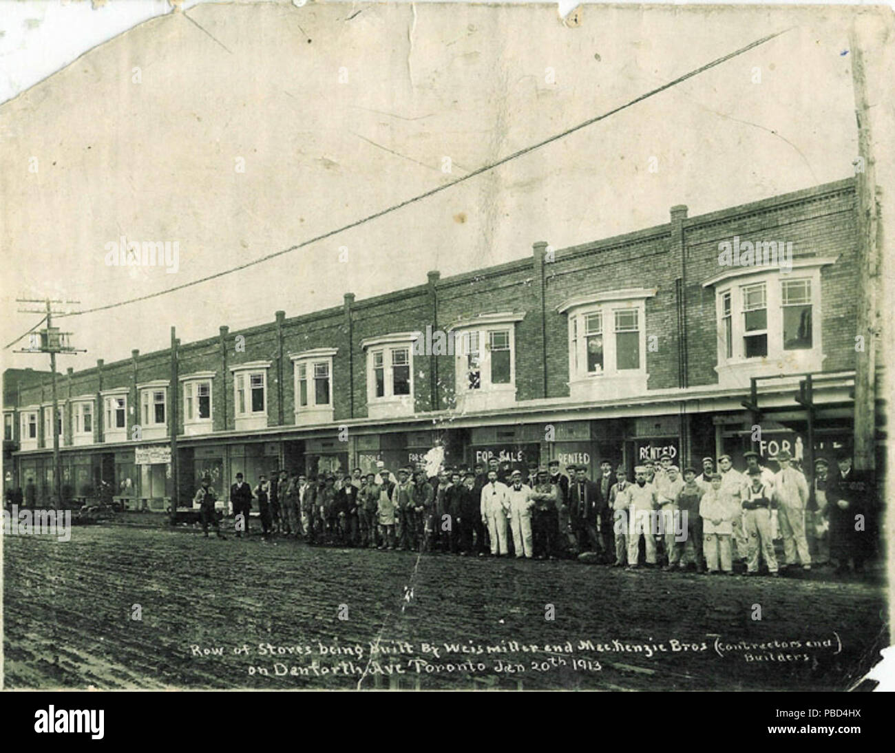 1273 Row of stores being built by Weismiller and Mackenzie Bros 1913 ...