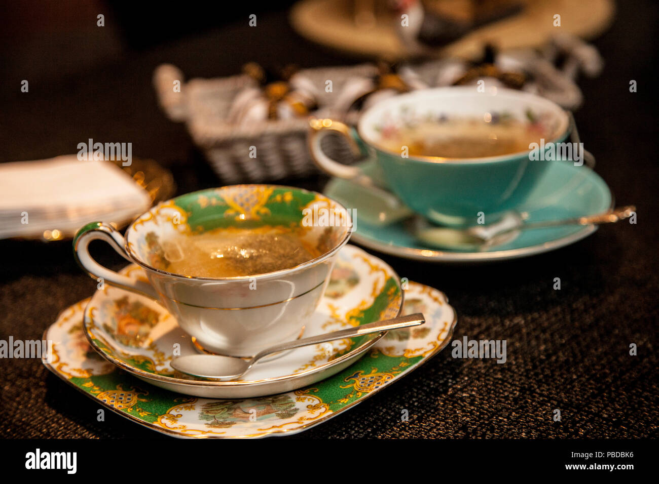 elegant tea cup on a dark wooden table. fancy afternoon tea concept ...