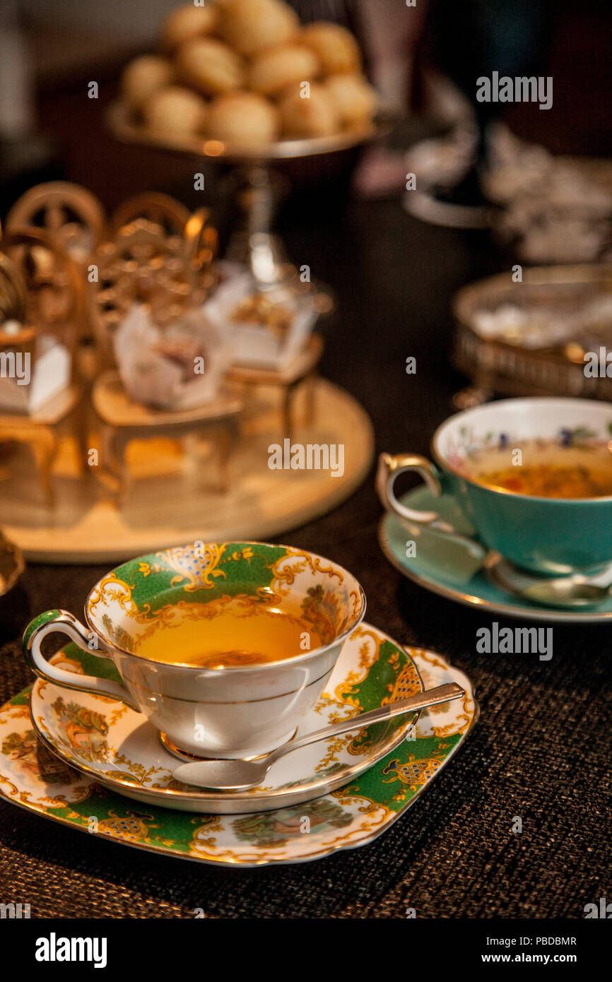 elegant tea cup on a dark wooden table. fancy afternoon tea concept ...