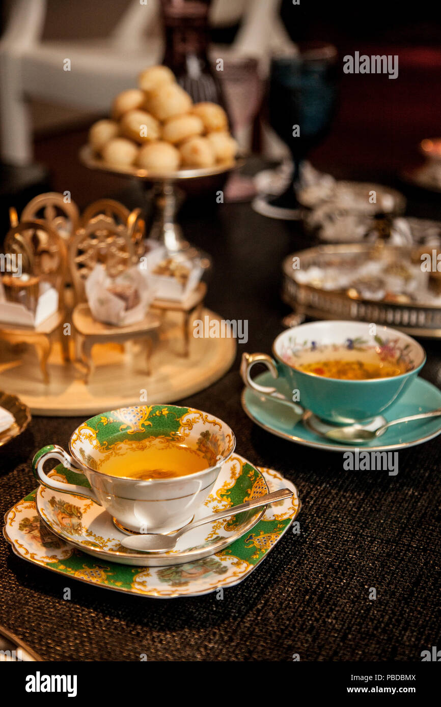 elegant tea cup on a dark wooden table. fancy afternoon tea concept ...