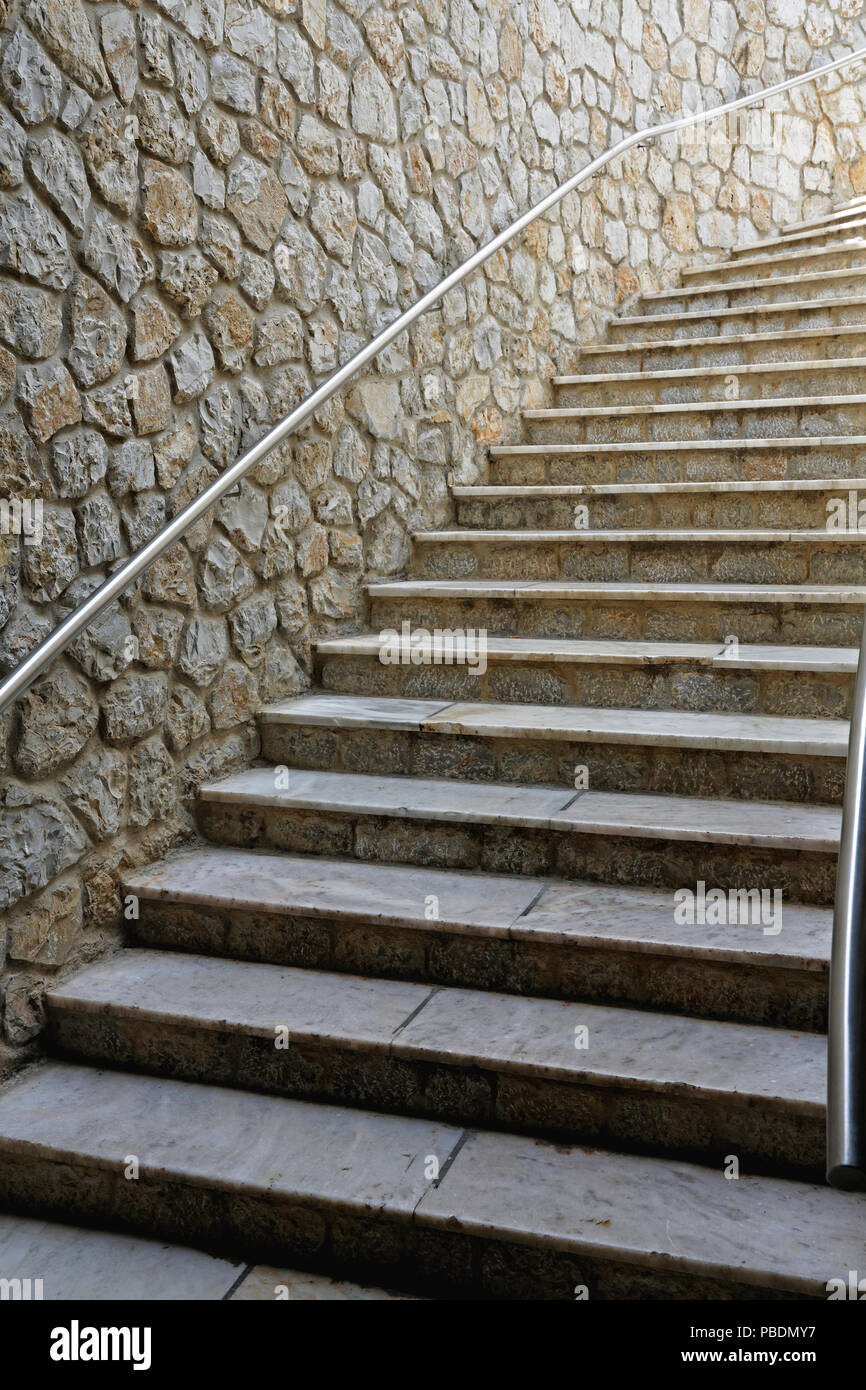 Flight of Stairs with banister at stone wall Stock Photo - Alamy