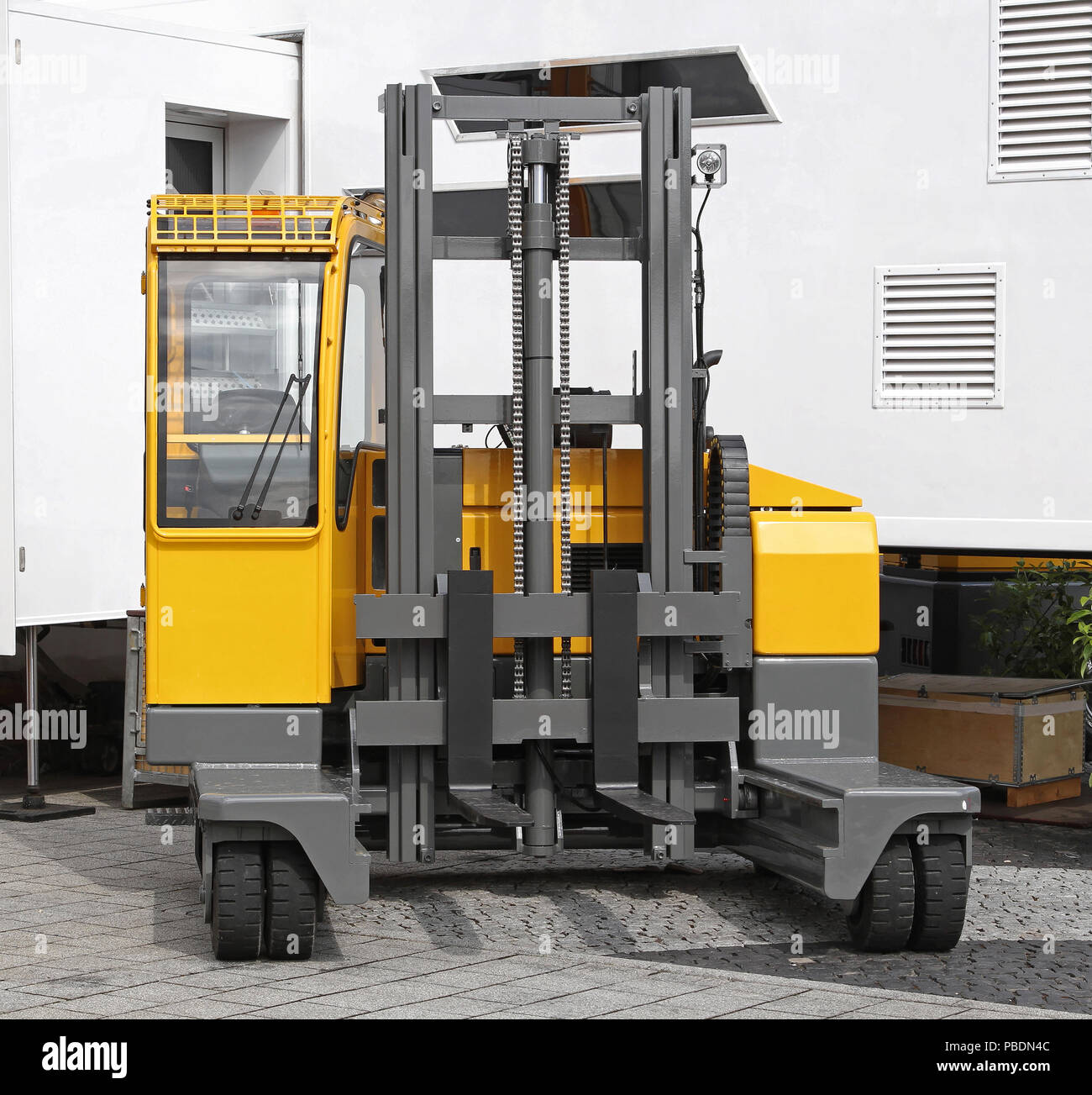 Side loader forklift for distribution warehouse Stock Photo - Alamy
