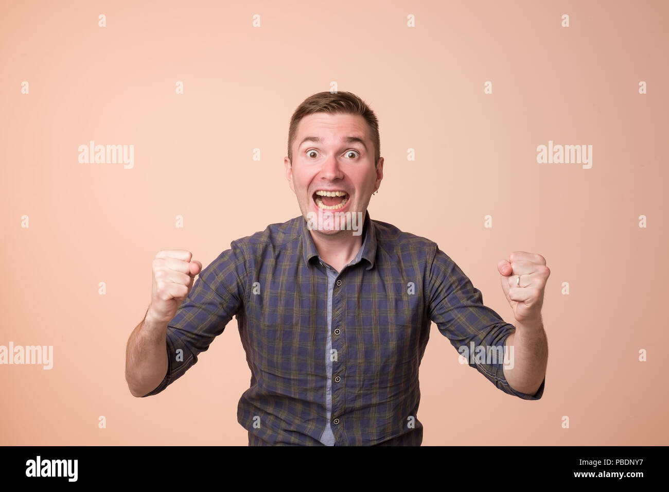 Portrait of young european man with shocked facial expression. He can ...