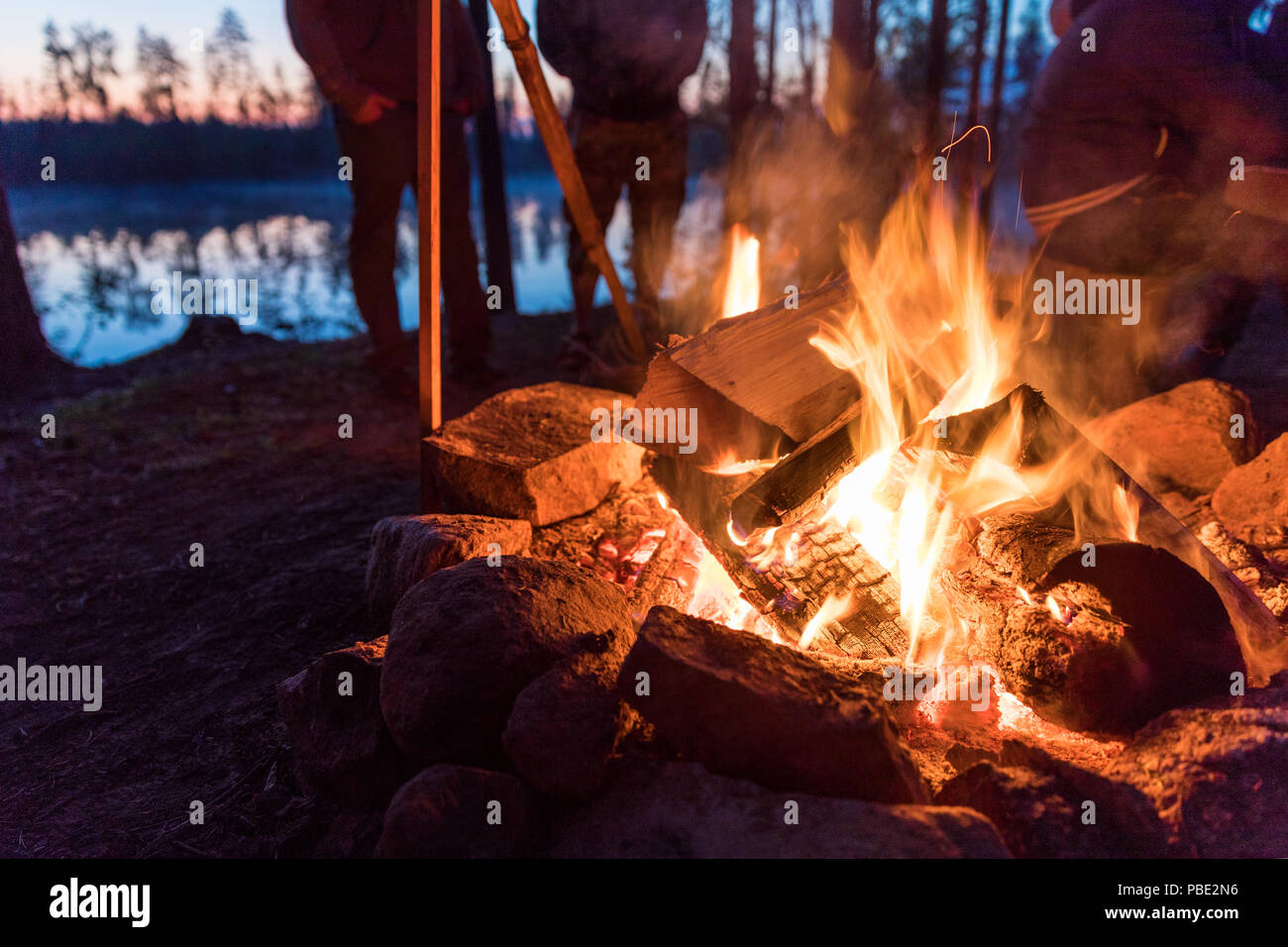 Fireplace in camping near lake at dark night Stock Photo - Alamy