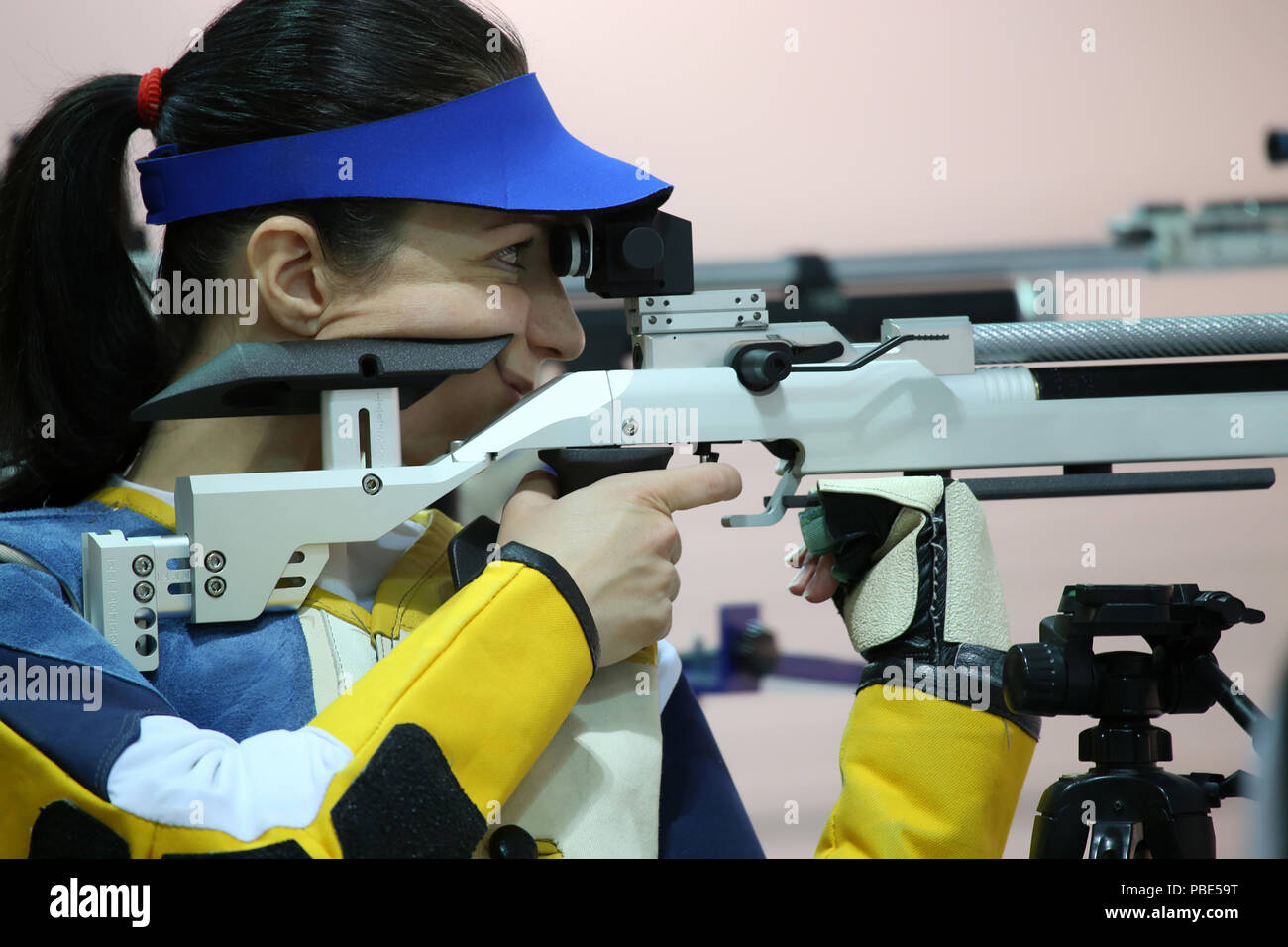 beautiful young woman aiming a pneumatic air rifle Stock Photo - Alamy
