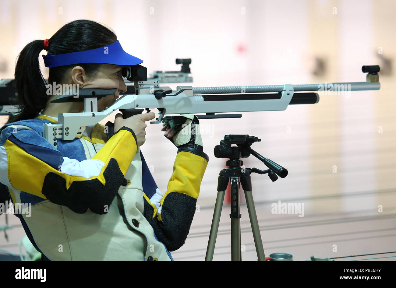 beautiful young woman aiming a pneumatic air rifle Stock Photo - Alamy