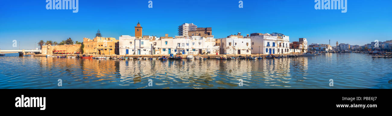 Panoramic view of waterfront with kasbah wall and picturesque houses in ...