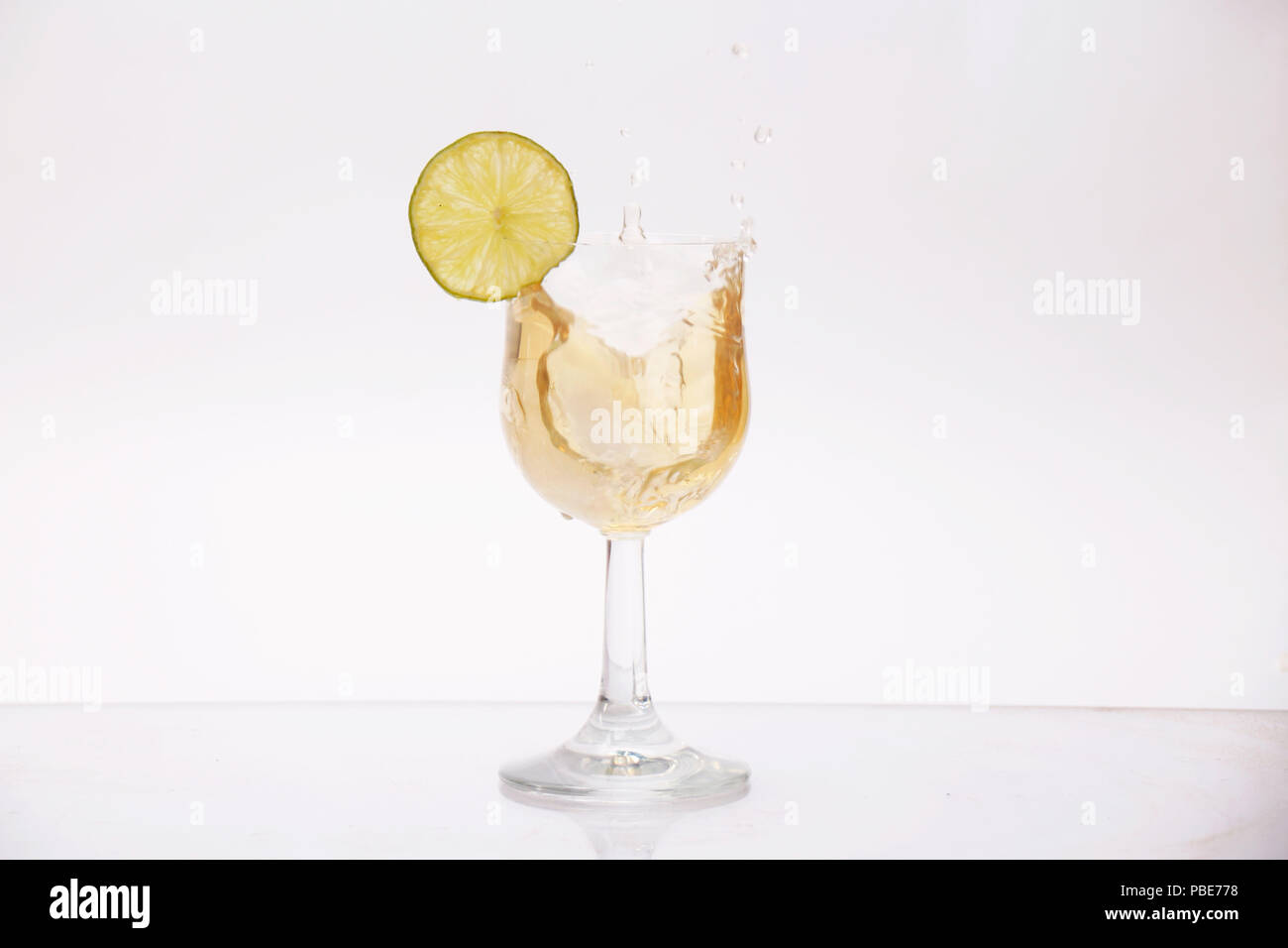 Ice block drop into a Cocktail Drink and causes a splash Stock Photo ...