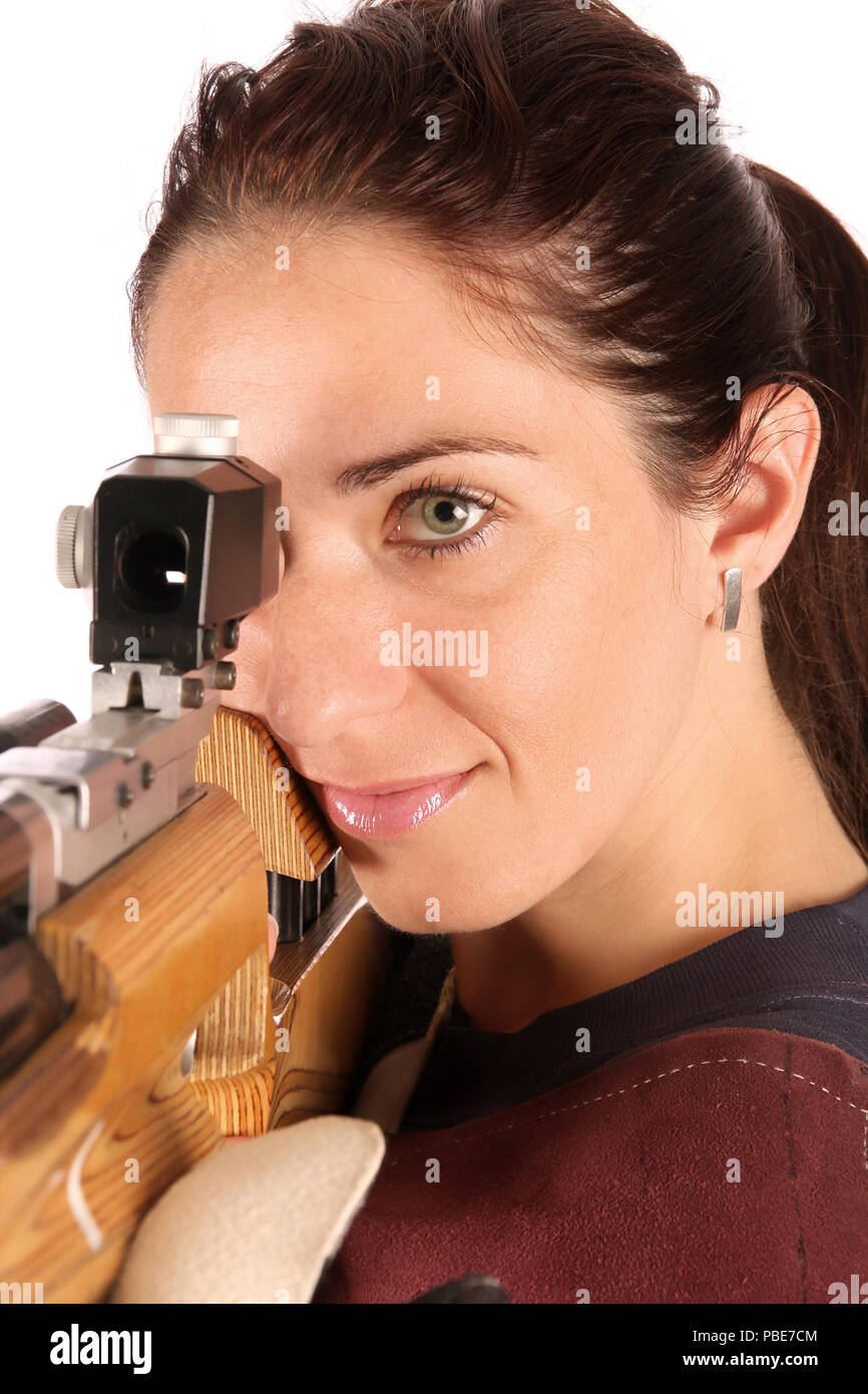 beautiful young woman aiming a pneumatic air rifle Stock Photo - Alamy