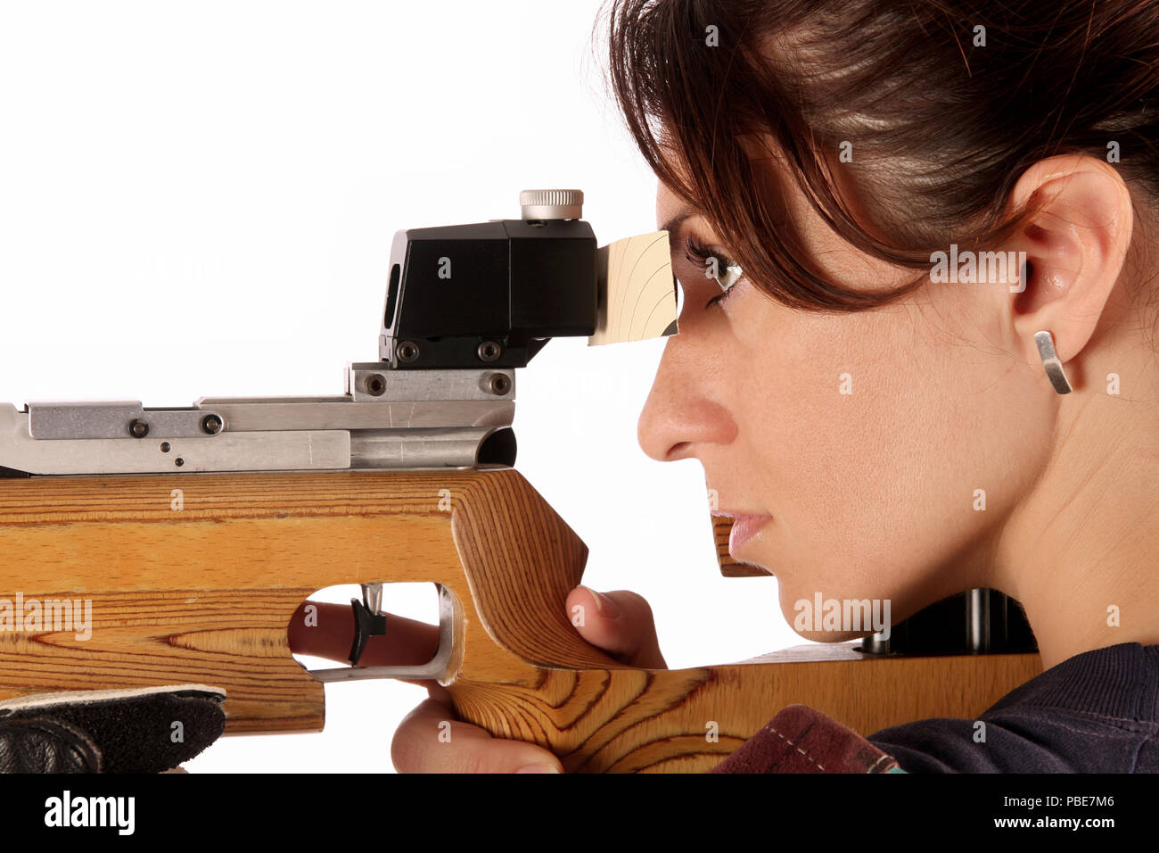beautiful young woman aiming a pneumatic air rifle Stock Photo - Alamy