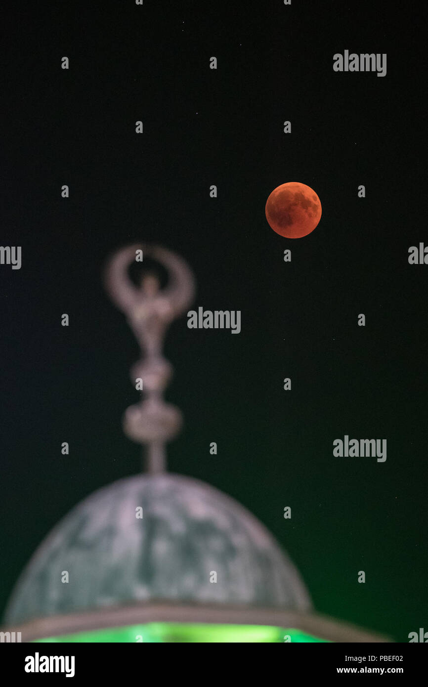 Jerusalem. 27th July, 2018. Photo taken on July 27, 2018 shows the moon ...