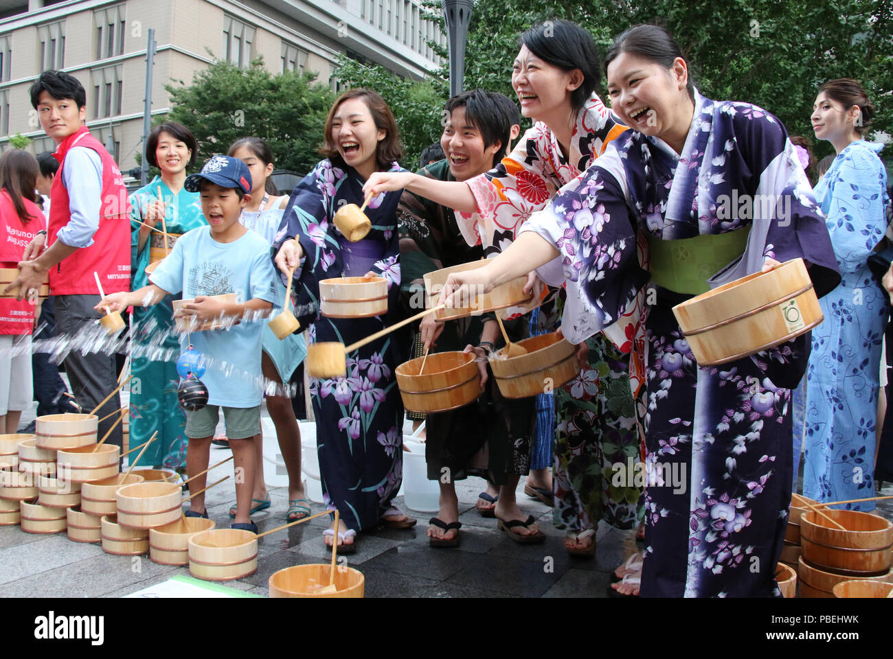 Office workers sprinkle water pavement hi-res stock photography and ...