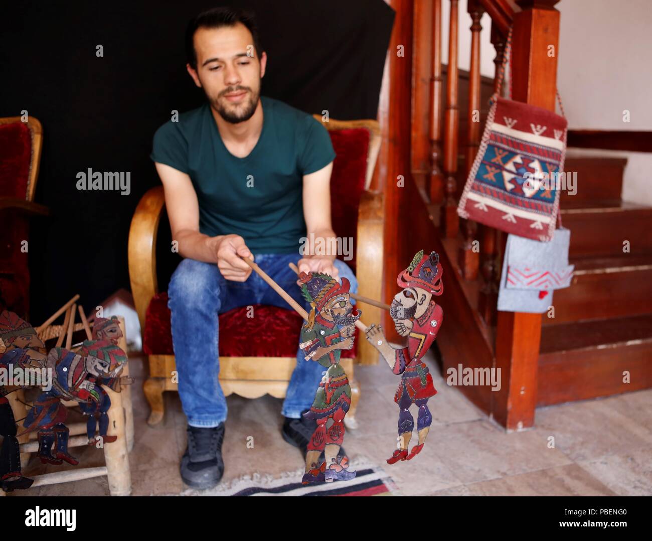 Ankara, Turkey. 25th July, 2018. An artist shows the puppets of ...