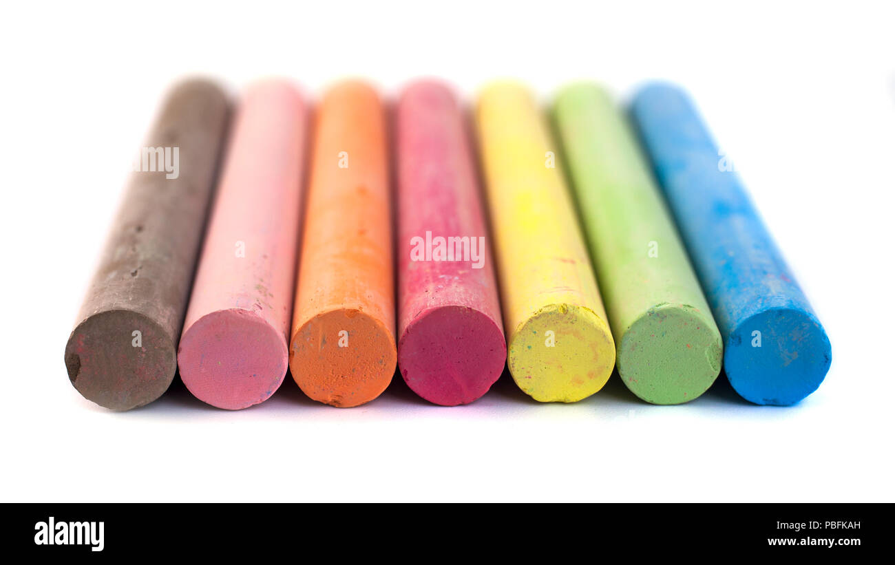 Colored chalks on white background with soft shadows Stock Photo - Alamy