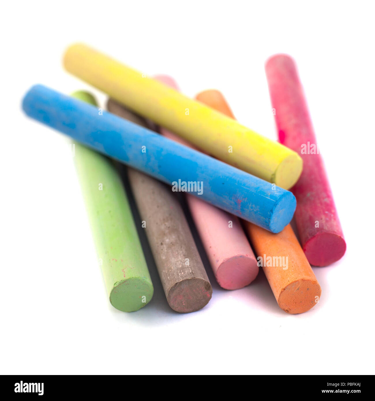 Colored chalks on white background with soft shadows Stock Photo - Alamy